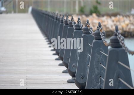 Wooden chain pillar on dock. Fencing Chain wall. Selective Focus Stock ...