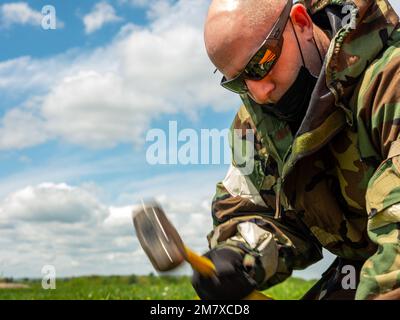 An Airman with the 109th Airlift Wing prepare a radial aerial marker to ...