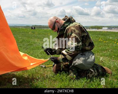 An Airman with the 109th Airlift Wing prepare a radial aerial marker to ...