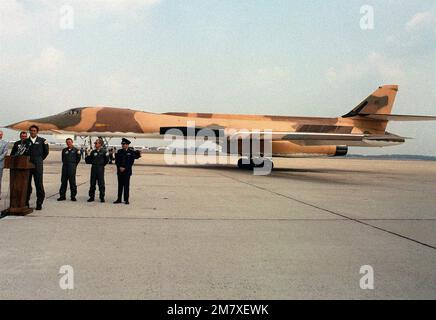 Members of the B-1 bomber aircraft test team pose in front of the B-1 ...