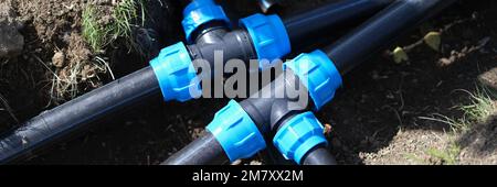PVC Three way pipe on wood plate Stock Photo - Alamy