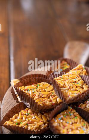 Desserts with almonds, peanuts and seeds in caramel. Traditional ...