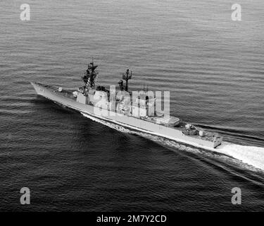 An aerial port quarter view of the destroyer COMPTE DE GRASSE (DD-974) bottom, the battleship ...
