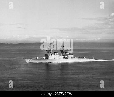 An aerial port quarter view of the destroyer COMPTE DE GRASSE (DD-974) bottom, the battleship ...