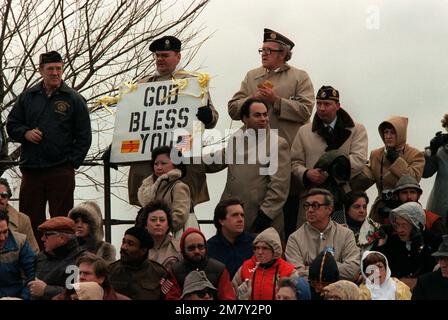 Spectators watch the Washington Pride parade, Saturday, June 20, 2026 ...