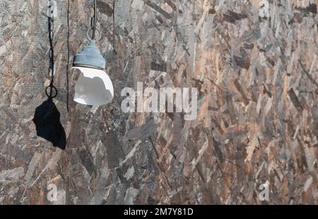 Broken lantern with shadow on textured wall in bright sunlight Stock ...