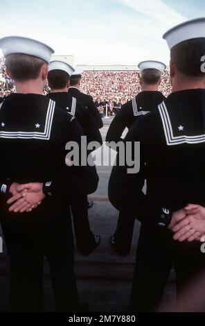 Crewmen stand at parade rest during commissioning ceremonies for the ...