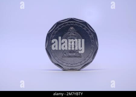 A front view of a Sri Lankan 10 rupee coin isolated on white background ...
