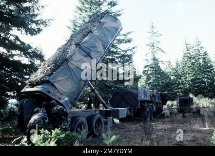 The launcher on a transport-erector-launcher (TEL) vehicle is raised ...