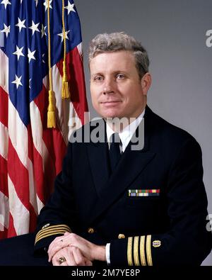 CAPT Thomas C. Watson Jr., center, commanding officer, explains the ...