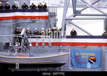 Crew members man the rail aboard the first Aegis guided missile cruiser ...