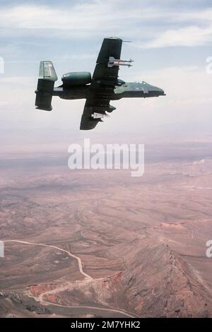 An air-to-air right underside view of two A-10 Thunderbolt II aircraft ...