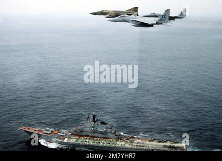 An air-to-air left side view of 18th Tactical Fighter Wing F-15 Eagle ...