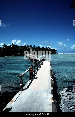 A view of a foot bridge connecting two islands. Country: Caroline ...