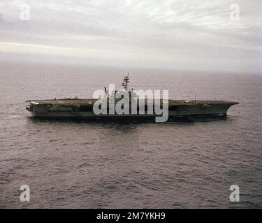 An aerial starboard side view of the aircraft carrier USS KITTY HAWK ...