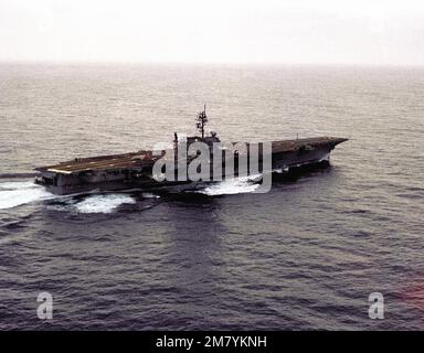 An aerial starboard quarter view of the aircraft carrier USS KITTY HAWK ...