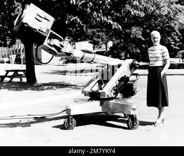 Sharon Hogge, an electronics engineer, poses with autonomous sentry ...