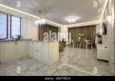 Studio apartment featuring classic kitchen with island, and wall ...