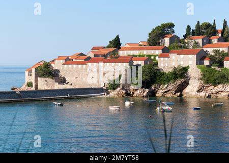 Boats moored in Sveti Stefan Bay, Montenegro Stock Photo - Alamy