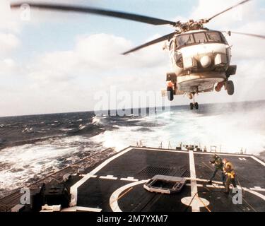 Crewmen aboard the guided missile frigate USS AUBREY FITCH (FFG-34 ...