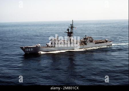 An aerial port bow view of the frigate USS Glover (FF-1098) underway ...