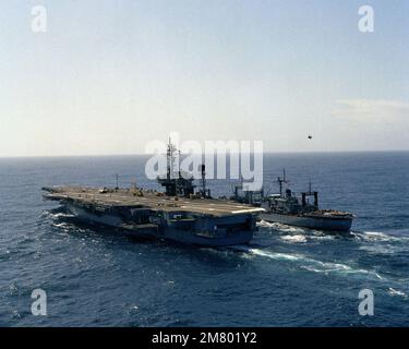 An aerial port quarter view of the ammunition ship USS BUTTE (AE-27 ...