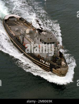 The large harbor tug Canonchet (YTB-823) pulls the aircraft carrier USS ...