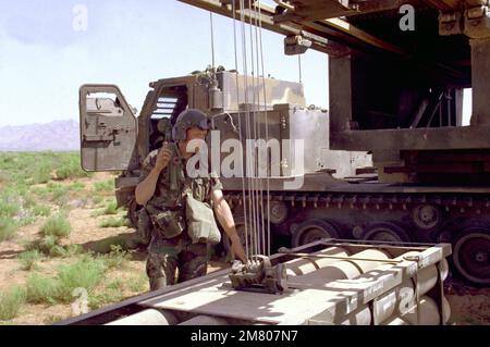 A member of the 3rd Bn., 6th Field Arty., 1ST Infantry Div., operates a ...