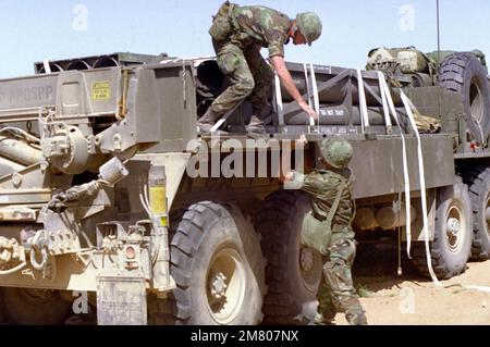 A member of the 3rd Bn., 6th Field Arty., 1ST Infantry Div., prepares a ...