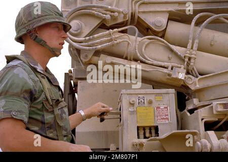 A member of the 3rd Bn., 6th Field Arty., 1ST Infantry Div., operates a ...