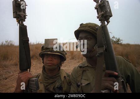 Members of Co. B, 1ST Bn., 35th Inf., 25th Inf. Div., pass alongside ...