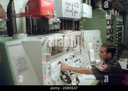 A member of the 321st Strategic Missile Wing works at a control panel ...