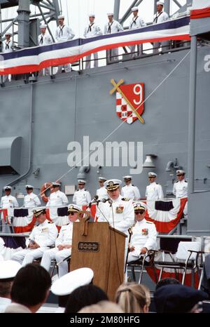A guest speaker addresses the spectators attending the commissioning ...