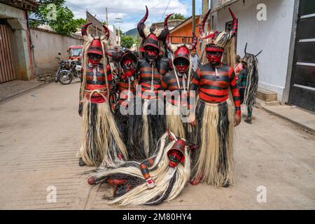 Celebrants in cachudo costumes with masks & horns at the Fiesta of ...