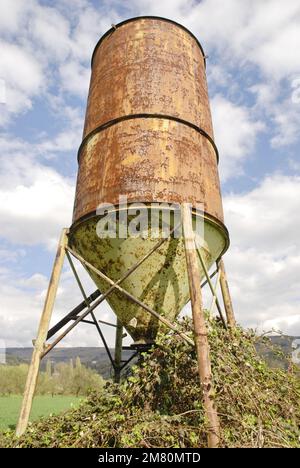 Old rusted out water tank with solar panel, Pilbara, Western Australia ...
