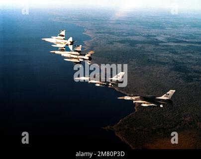 A left side view of two F-16A Fighting Falcon aircraft during ...