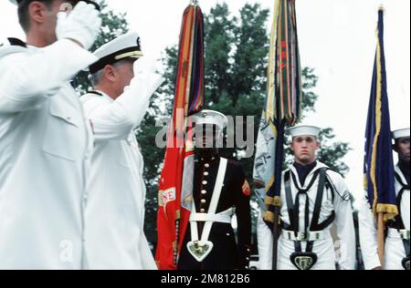 U.S. Navy officers stand guard aboard the Virginia-class fast-attack ...