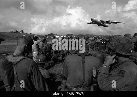 Vice Admiral Joseph Metcalf, Commander of Task Force 120, speaks with a ...