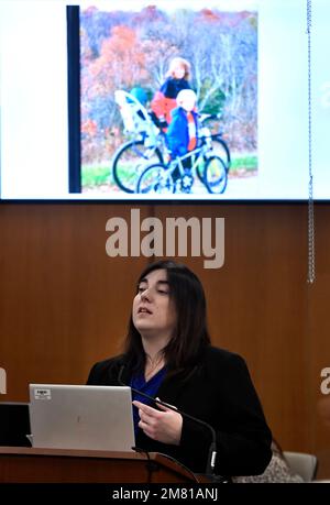 Deputy District Attorney Carli McNeill, left, hands Kelly Brooks, Mark ...