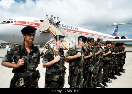 Personnel armed with M16 rifles guard the entry control point to ...