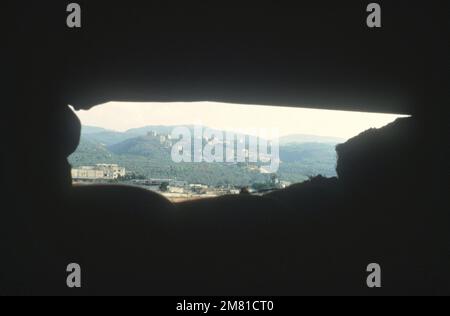 A view from inside a bunker as Marines observe the road leading into a ...