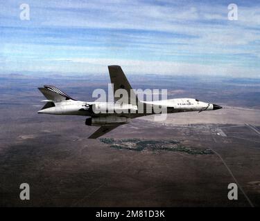 An air-to-air left side view of a B-1B bomber during an acceptance ...