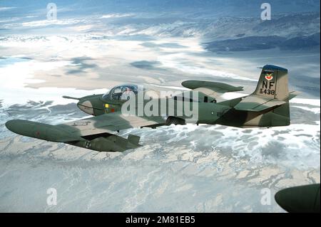 An air-to-air left side view of an A-37 Dragonfly aircraft in use ...