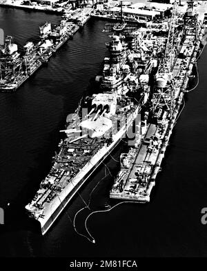 Elevated port bow view of the battleship USS IOWA (BB 61) passing through the Gaillard Cut as it ...