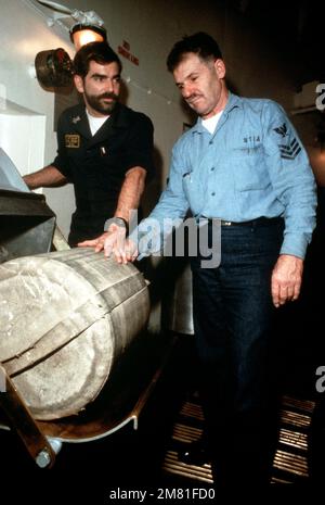 GUNNER's Mate 2nd Class (GMG2) Bill Owens explains the operation of the ...