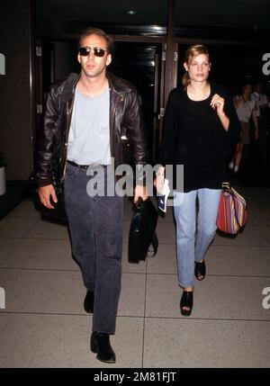 Nicolas Cage and girlfriend Kristen Zang on July 28, 1993 arrive at the ...