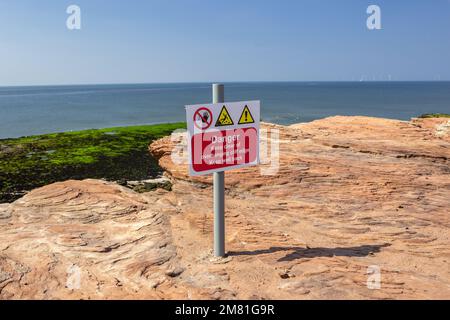 Cliff danger warning sign. Keep away from the cliff edge concept ...