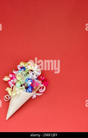 Paper cone with colorful party streamers Viva Magenta background Stock ...