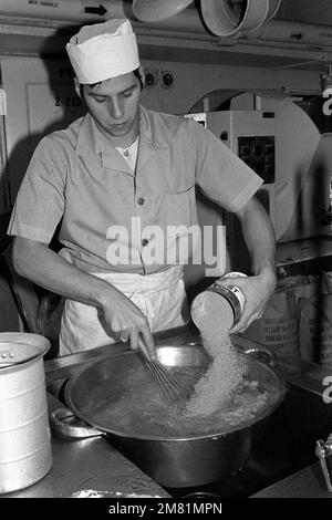 Mess Management SPECIALIST SEAMAN (MSSN) Irving Lyons pours sugar into ...