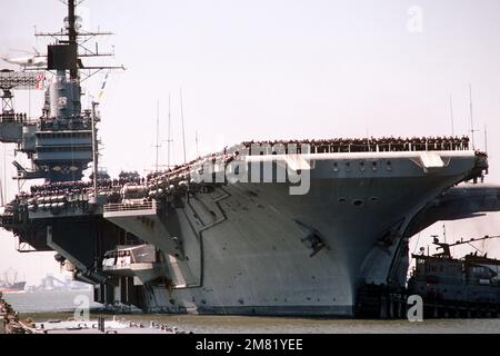 The large harbor tug WATHENA (YTB 825) maneuvers the battleship ...